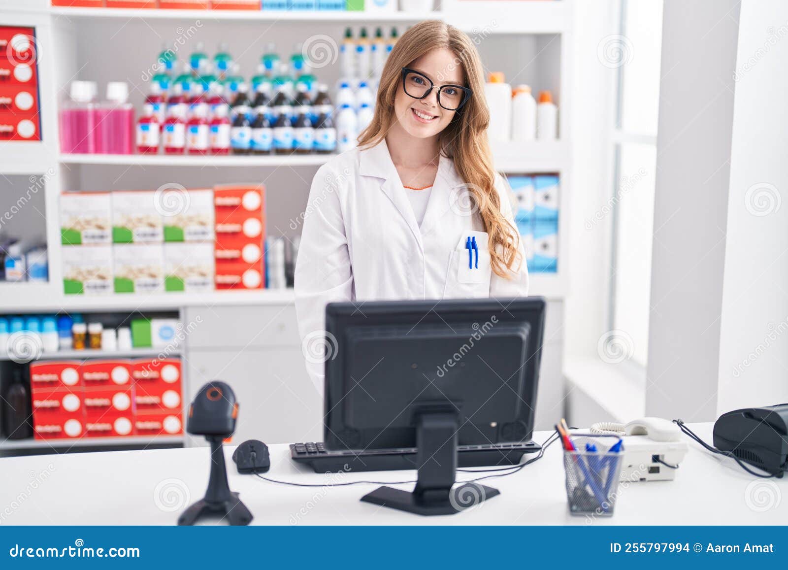 Young Woman Pharmacist Smiling Confident Using Computer at Pharmacy ...