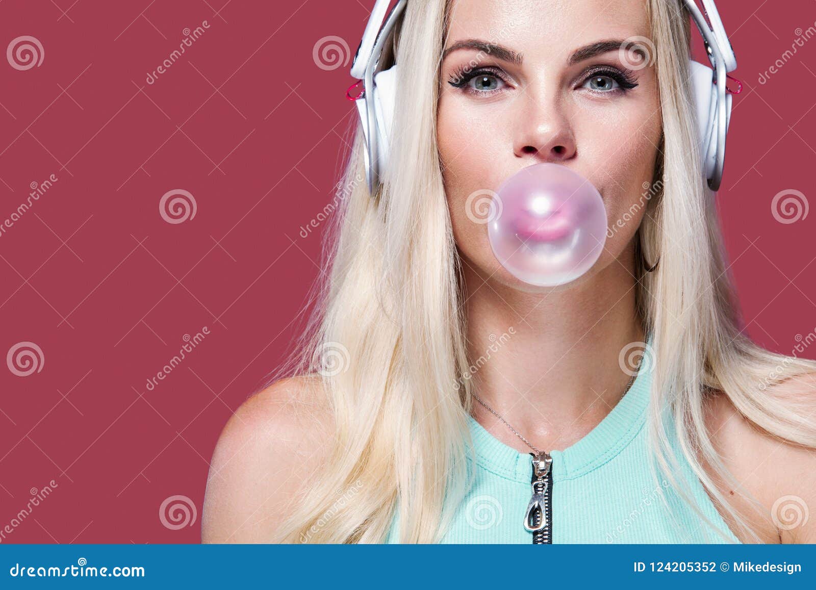 Beautiful Blonde Woman Blowing Pink Bubble Gum Girl Listen Music In