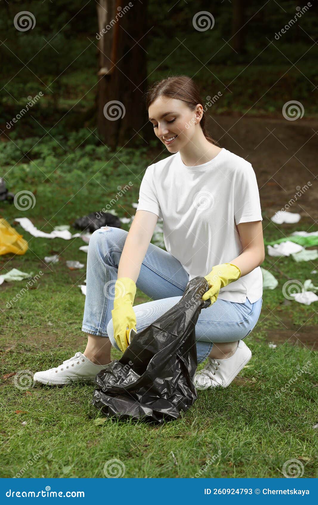 Young Woman with Plastic Bag Collecting Garbage in Park Stock Image ...