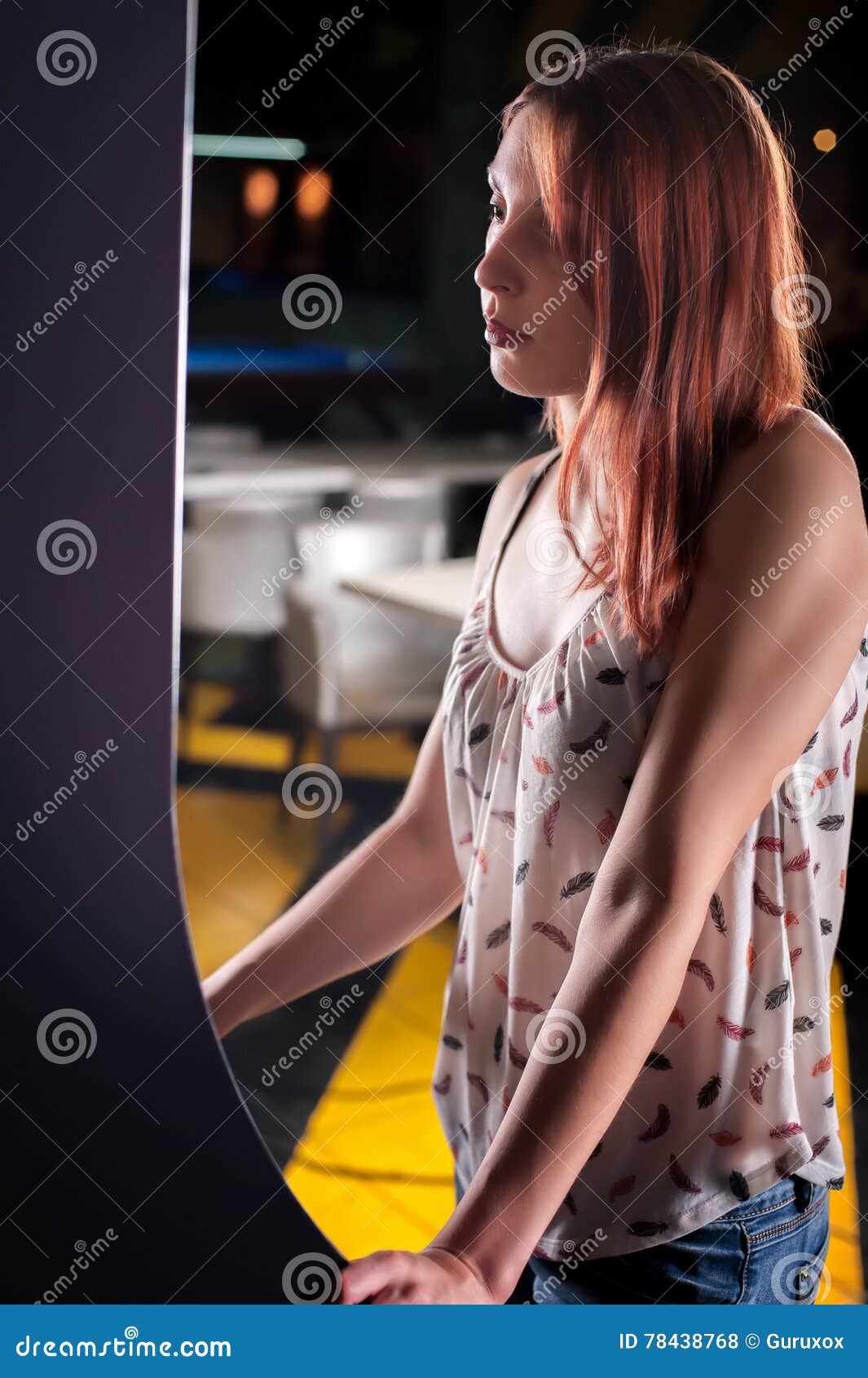 Young woman playing arcade stock photo. Image of button - 78438768