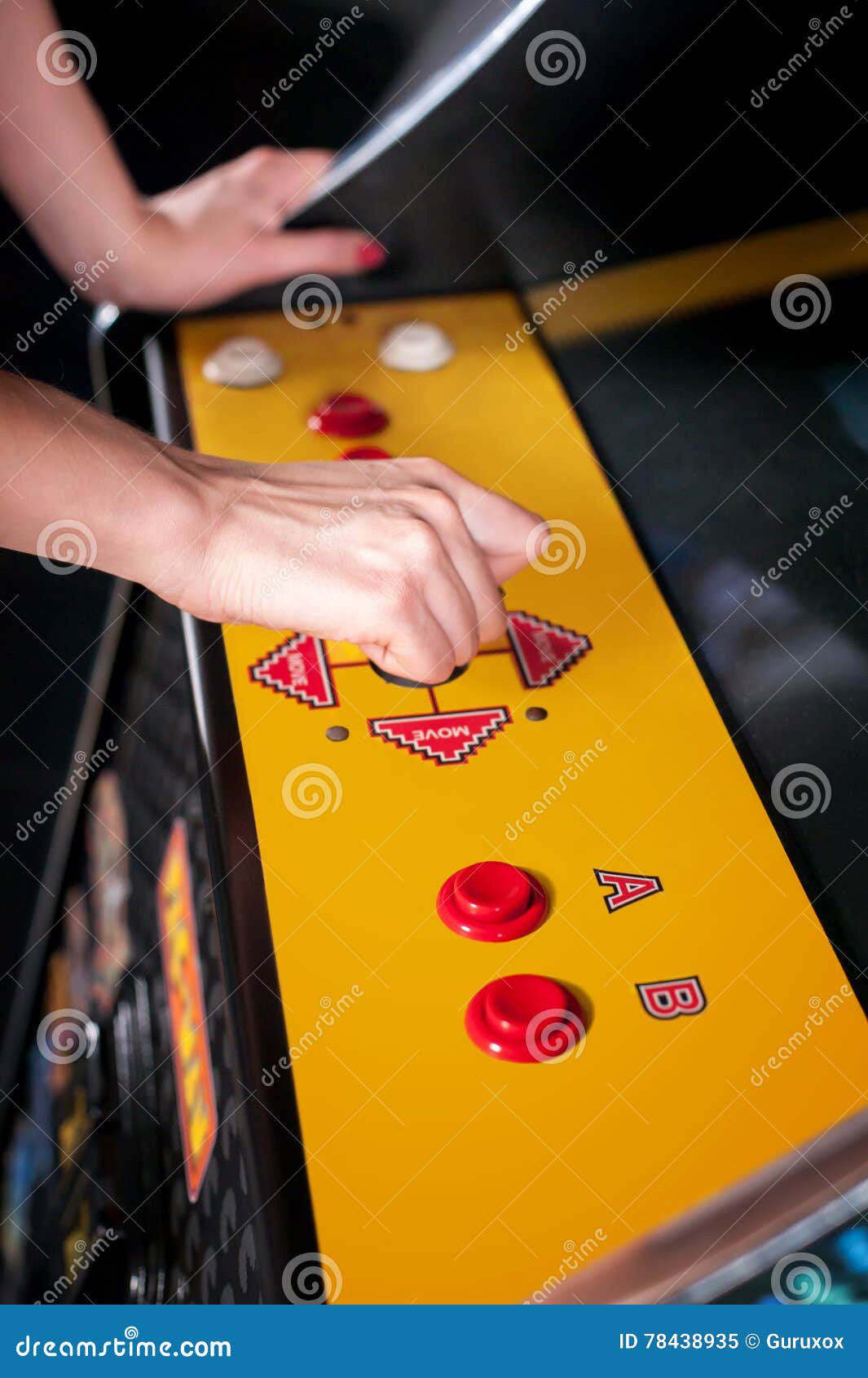 Young woman playing arcade stock image. Image of finger - 78438935