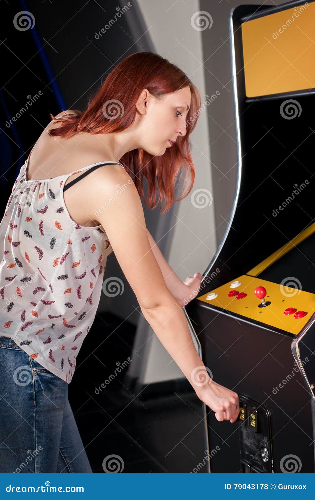 Young woman playing arcade stock photo. Image of modernism - 79043178