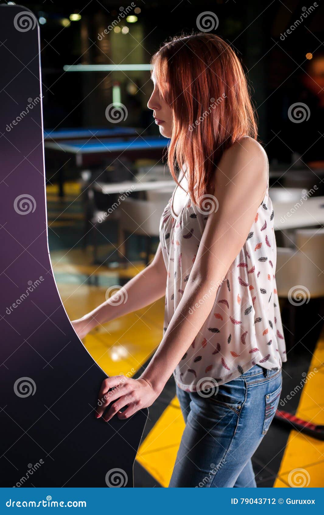 Young woman playing arcade stock photo. Image of graphic - 79043712