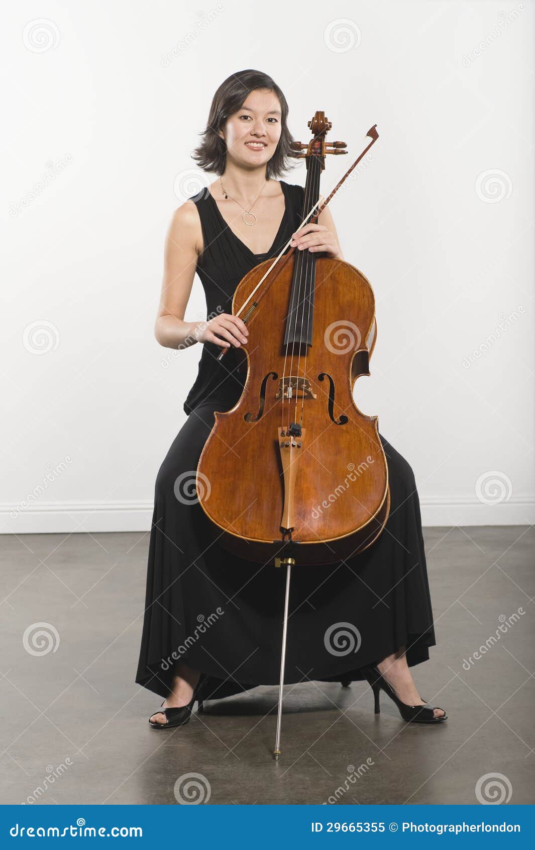 Young Woman Playing Cello stock image. Image of performer - 29665355
