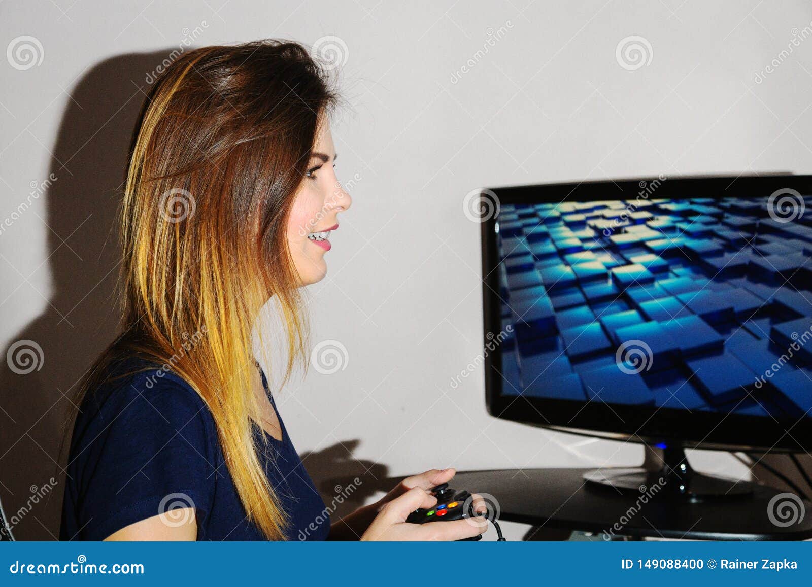Young Woman is Playing a Computer Game Stock Photo - Image of brunette ...