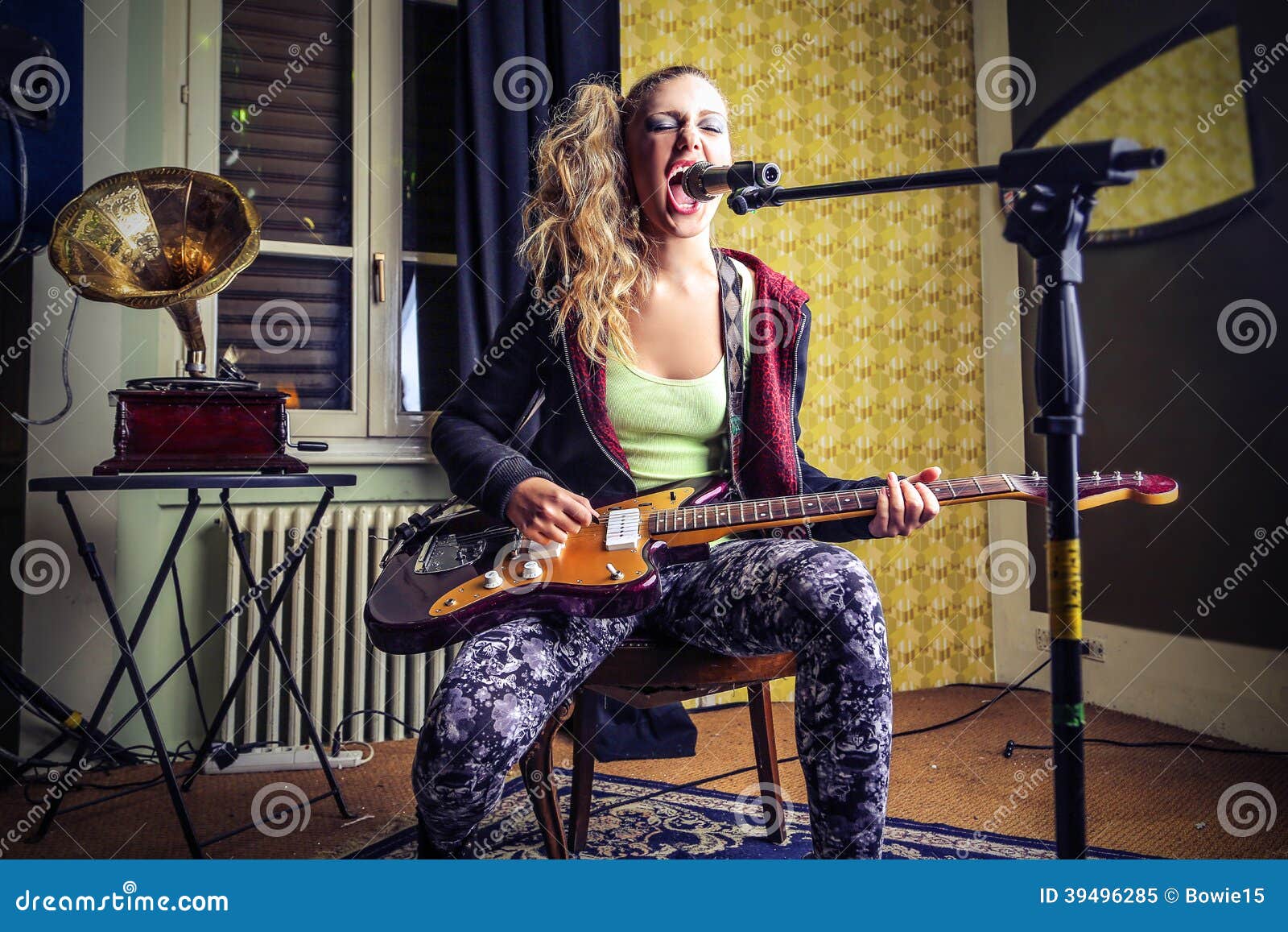 Young Woman Playing the Eletric Guitar and Singing Stock Image - Image ...