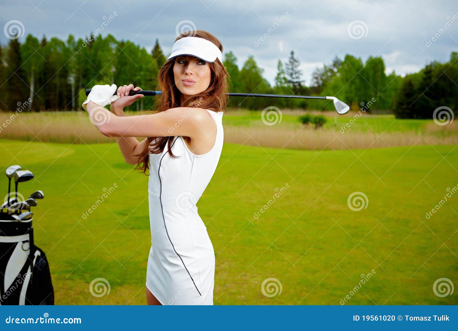 Young woman playing golf stock photo. Image of attractive - 19561020