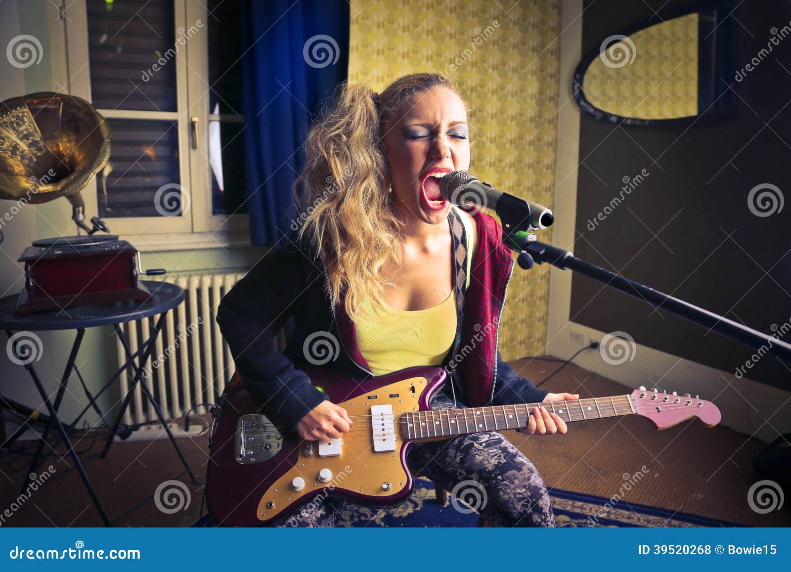Young Woman Playing the Guitar and Singing Stock Photo - Image of ...