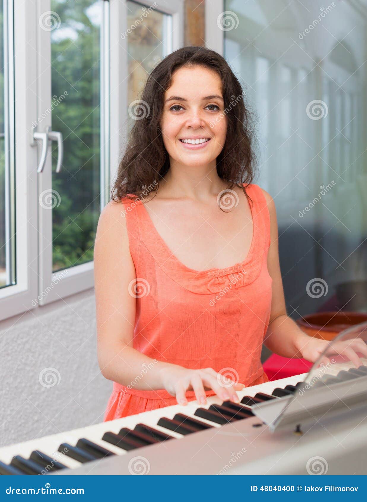 Young Woman Playing Piano at Home Stock Photo - Image of long ...