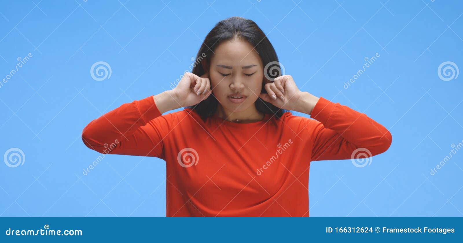 Young Woman Plugging Hear Ears with Fingers Stock Photo - Image of ...