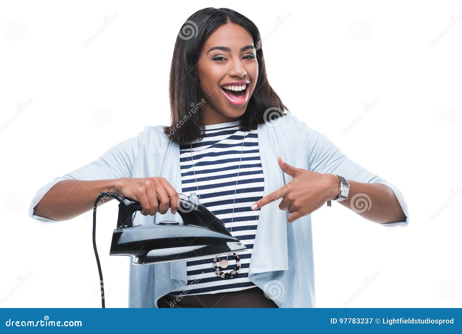 Young Woman Pointing at Iron and Smiling at Camera Stock Image - Image ...