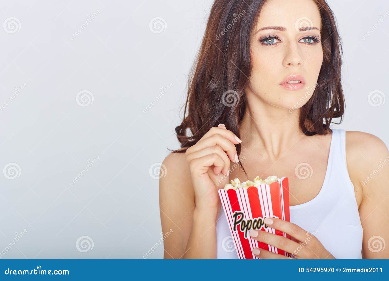 Young woman with popcorn stock photo. Image of warm, beautiful - 54295970