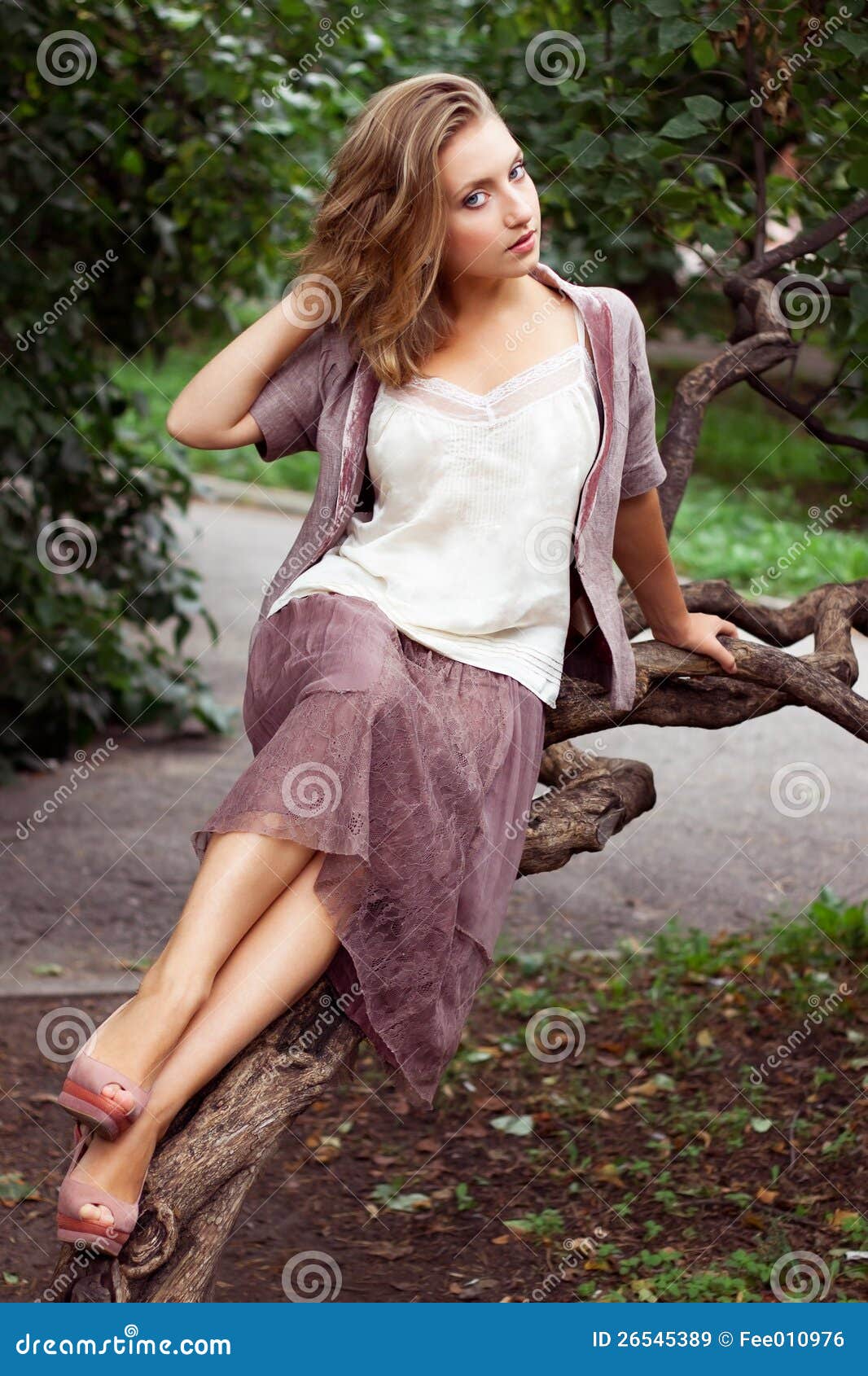 Young Woman Poses on Tree Branch Stock Image - Image of adult, pretty ...