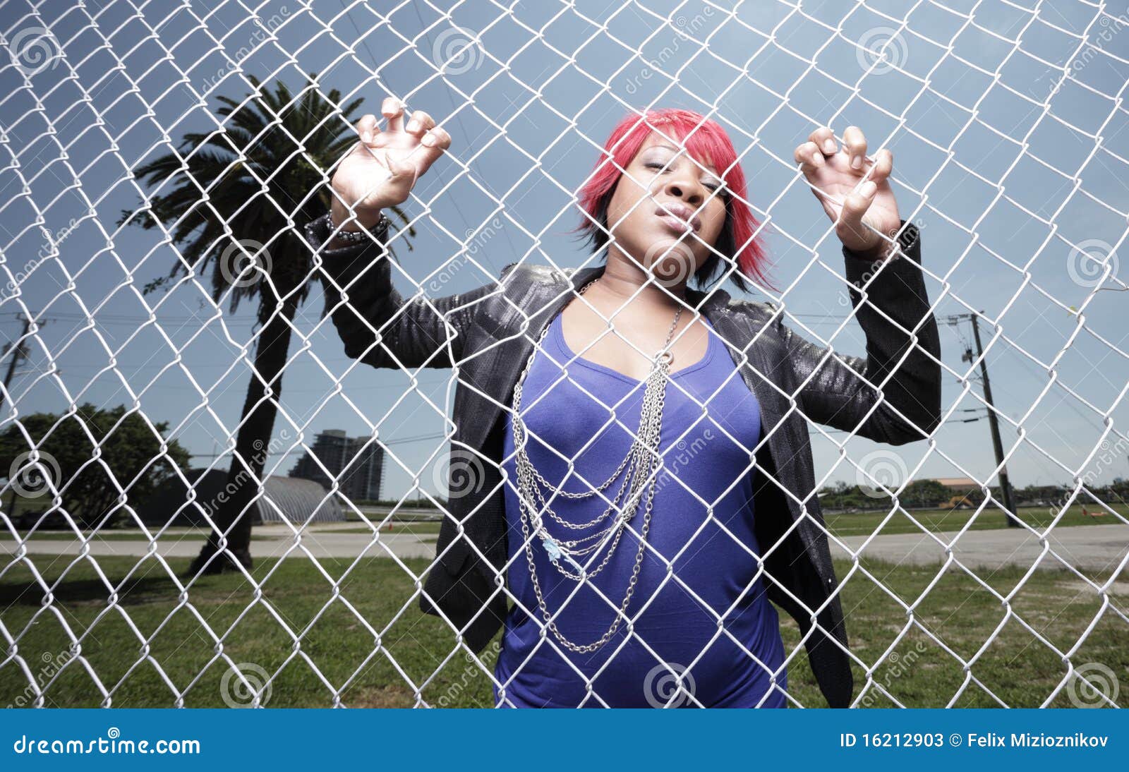 Young Woman Posing Behind the Fence Stock Image - Image of overweight ...