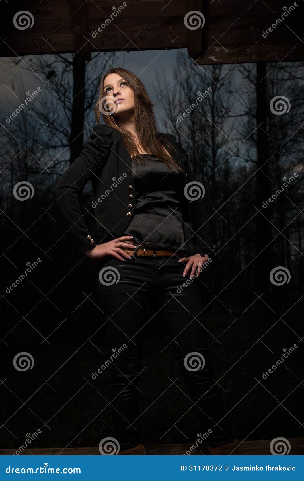 Young Woman Posing and Looking Up Stock Photo - Image of outdoors ...