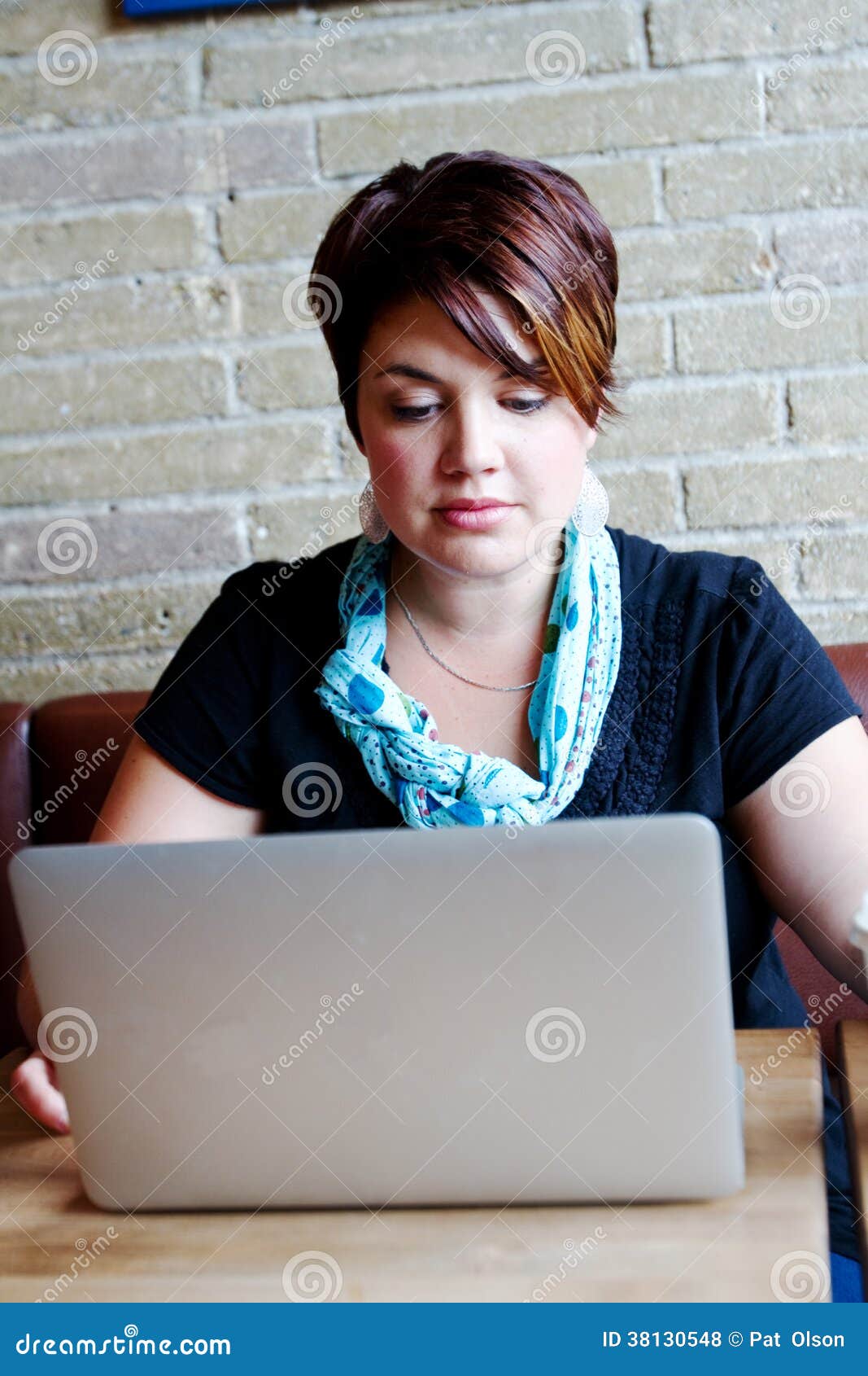 Young Woman Pouring Over Computer Stock Photo - Image of indoors ...