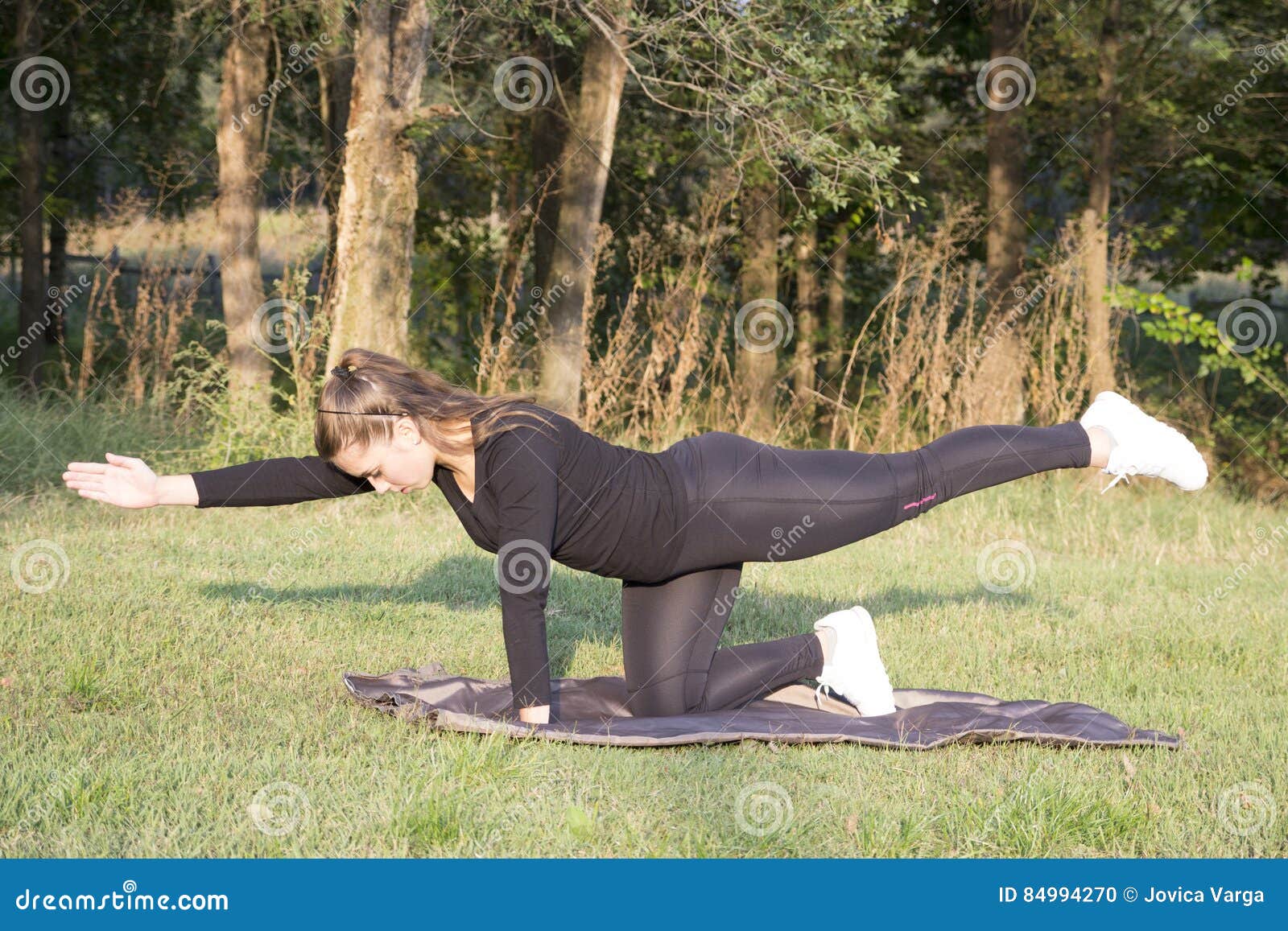 Young Woman Practicing Pilates in Nature Stock Photo - Image of balance ...