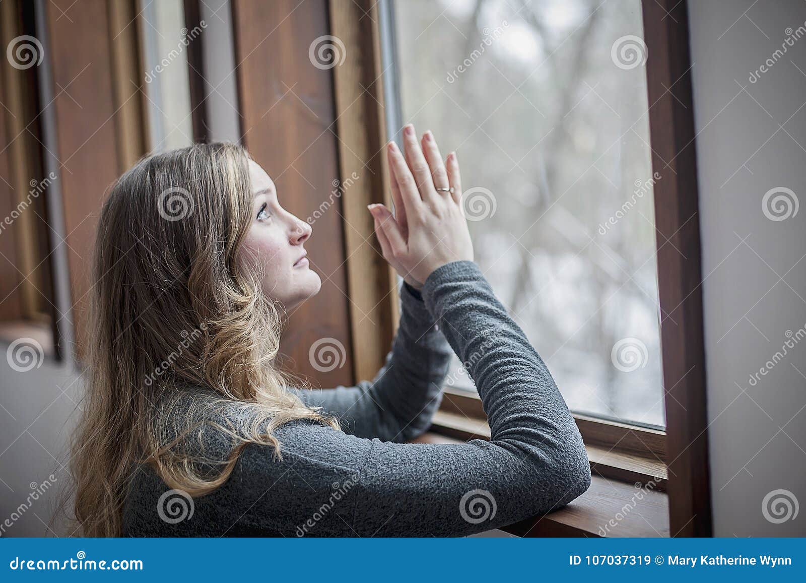 Young Woman Praying by Window Stock Image - Image of meditate, prayer ...