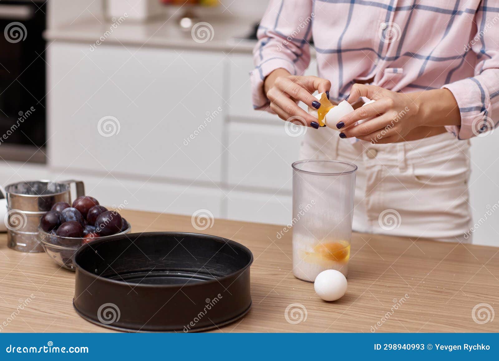 Young Woman Preparing Dough and Cracking Eggs Stock Image - Image of ...