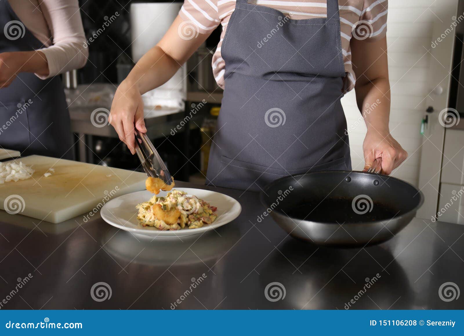 Young Woman Preparing Meal during Cooking Classes on Restaurant Kitchen ...
