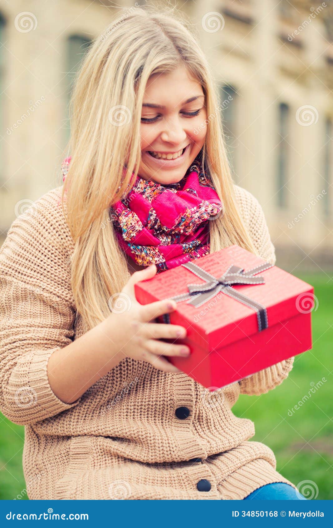 Young Woman with Present on Bench Stock Photo - Image of present ...