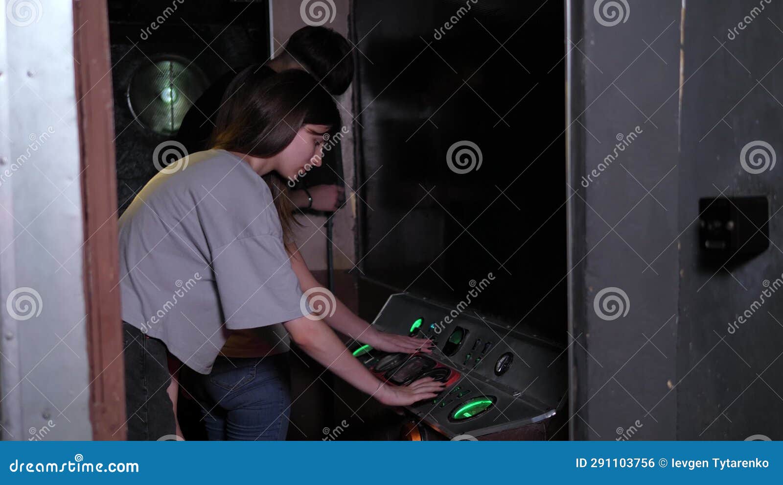A Woman Presses Buttons on an Old Control Panel in a Subway Car, Quest ...