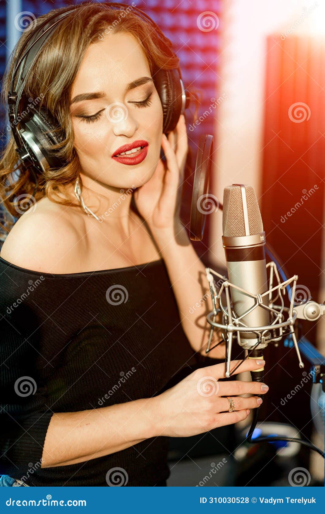Young Woman with the Professional Microphone in the Recording Studio ...