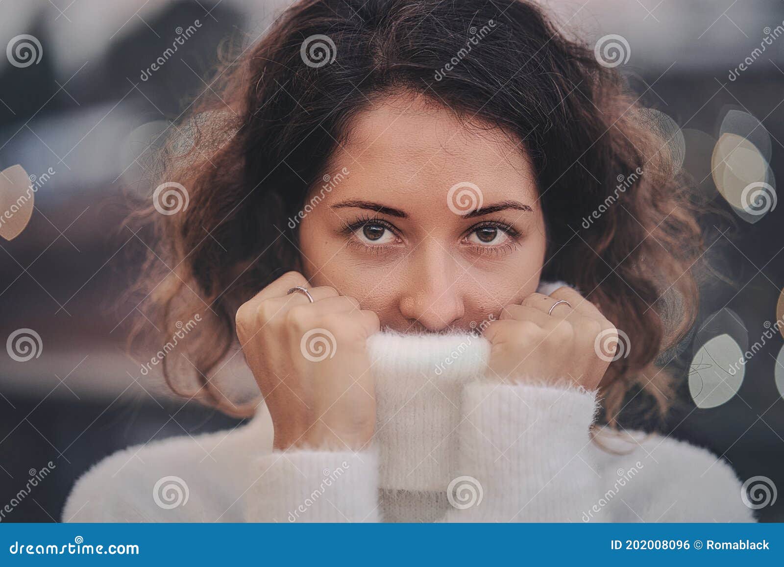 Young Woman Pulling Her White Sweater Over Head Stock Photo - Image of ...