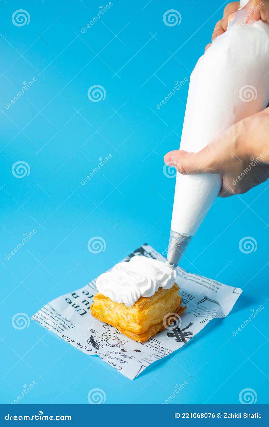 A Young Woman Put a Cream on Puff Pastries Stock Photo - Image of fancy ...