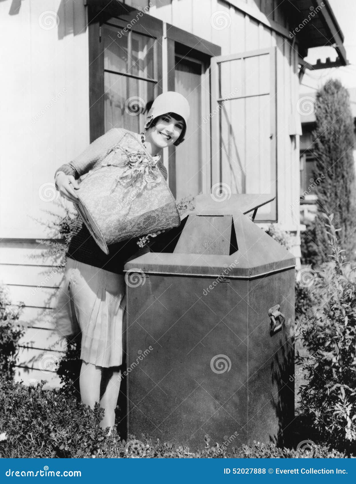 Young Woman Putting Garbage into a Garbage Can Stock Photo - Image of ...