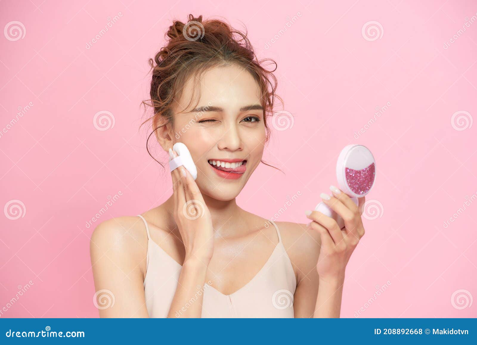 Young Woman Putting Powder on Her Face Stock Photo - Image of putting ...