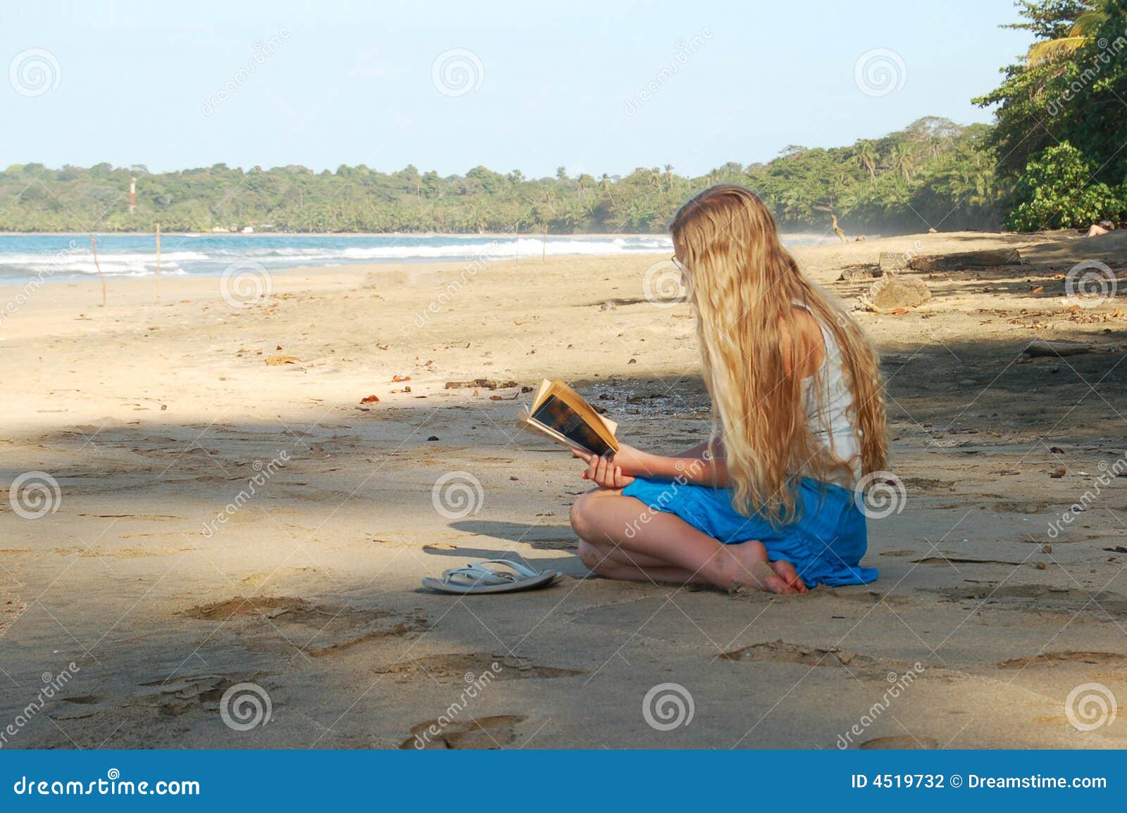 Young Woman Reading on Beach Stock Photo - Image of female, beach: 4519732