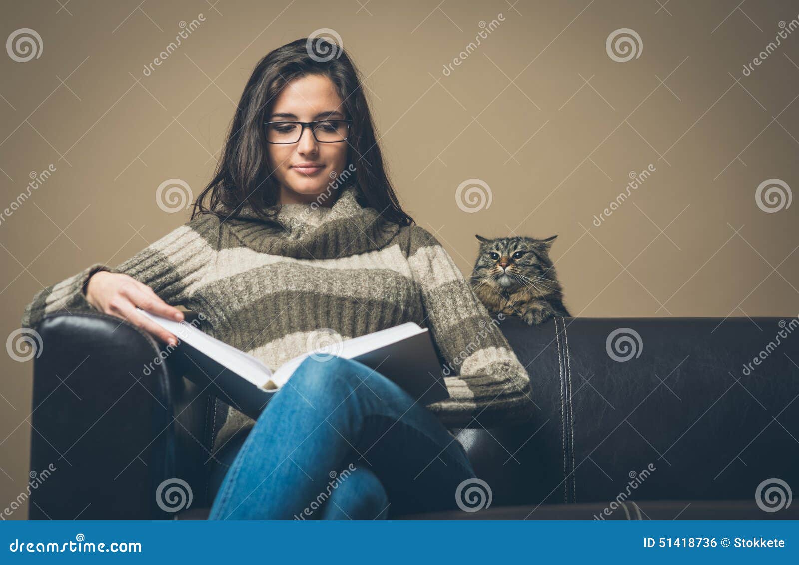 Young Woman Reading a Book with Curious Cat Stock Photo - Image of ...