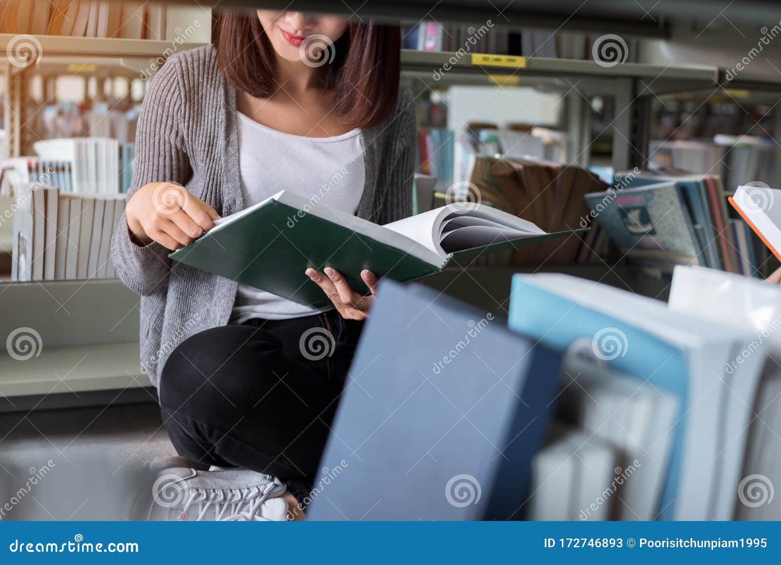 Young Woman Reading Book in Library, Studying and Learning Knowledge ...