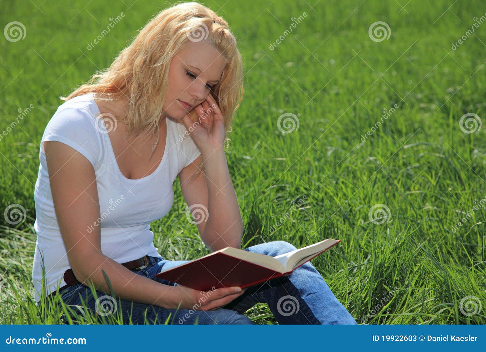Young Woman Reading a Book Outside Stock Image - Image of grass, blonde ...