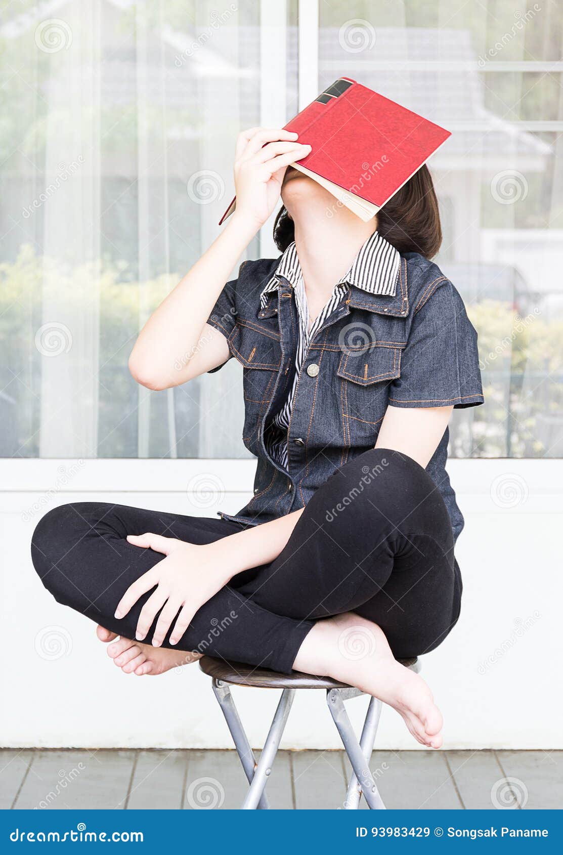 Young Woman Reading Book Sitting On Chair Stock Image Image Of Face