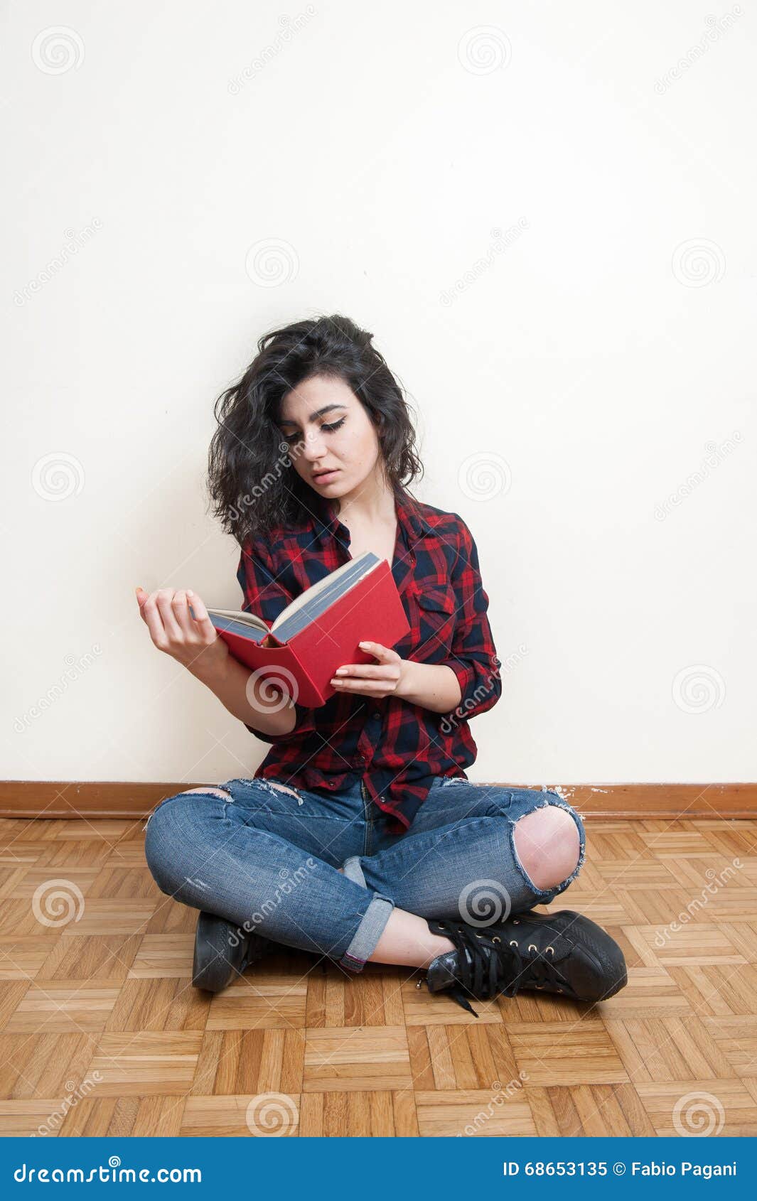 Young Woman Reading A Book Sitting On The Floor Stock Image Image Of