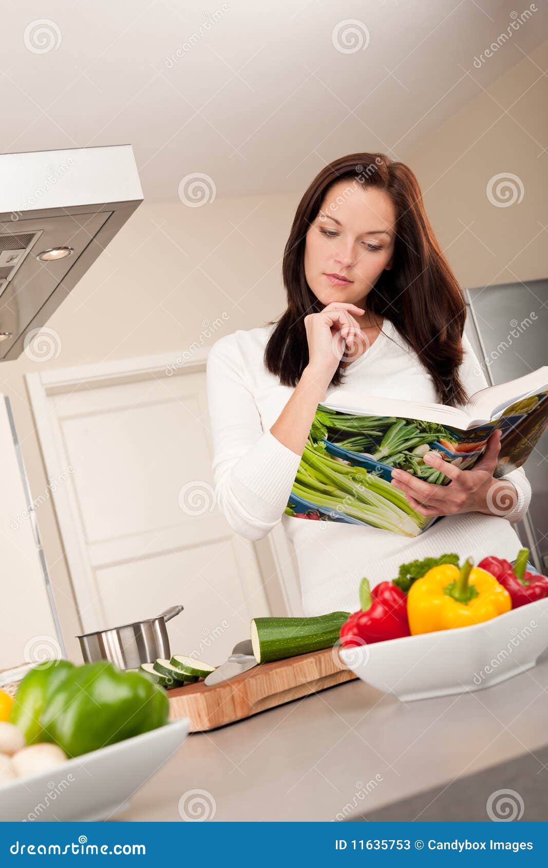 Young Woman Reading Cookbook in the Kitchen Stock Image - Image of ...