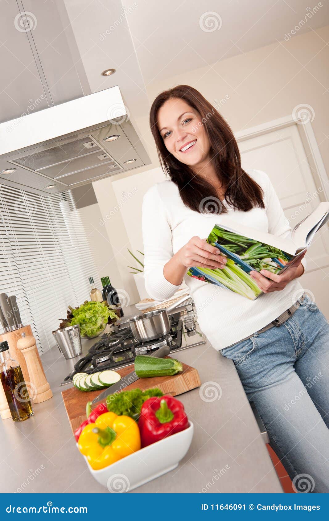 Young Woman Reading Cookbook in the Kitchen Stock Image - Image of ...