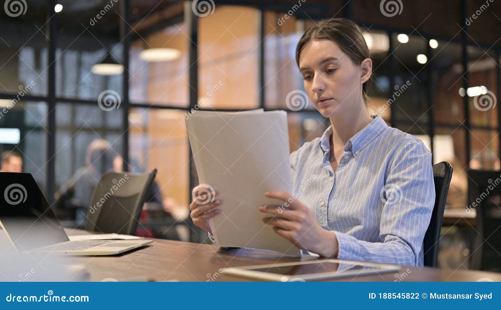 Young Woman Reading Documents at Work, Paperwork Stock Photo - Image of ...