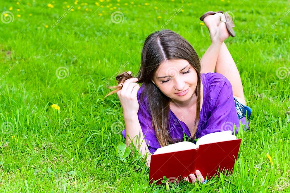Young Woman Reading on the Grass Stock Image - Image of woman, book ...