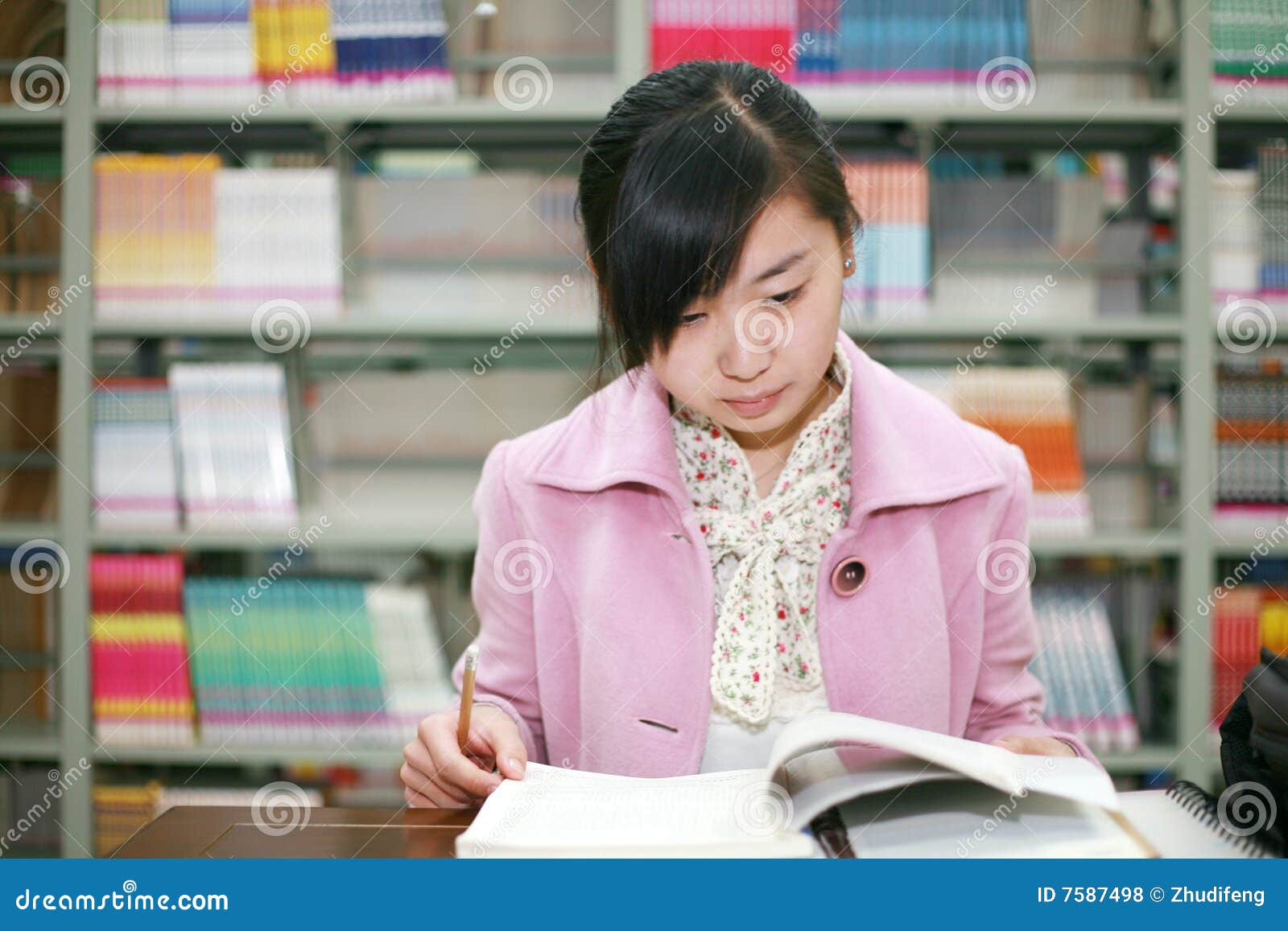 Young Woman Reading in Library Stock Photo - Image of inside, book: 7587498