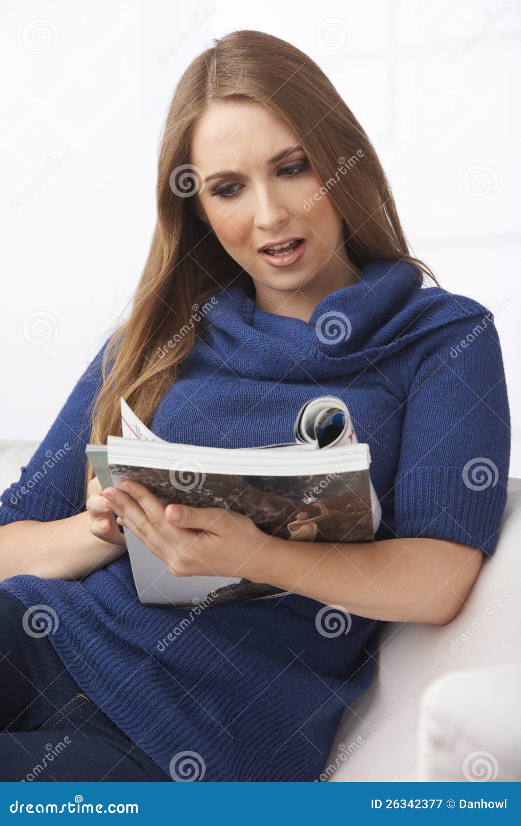Young Woman Reading Magazine Stock Image - Image of woman, indoor: 26342377