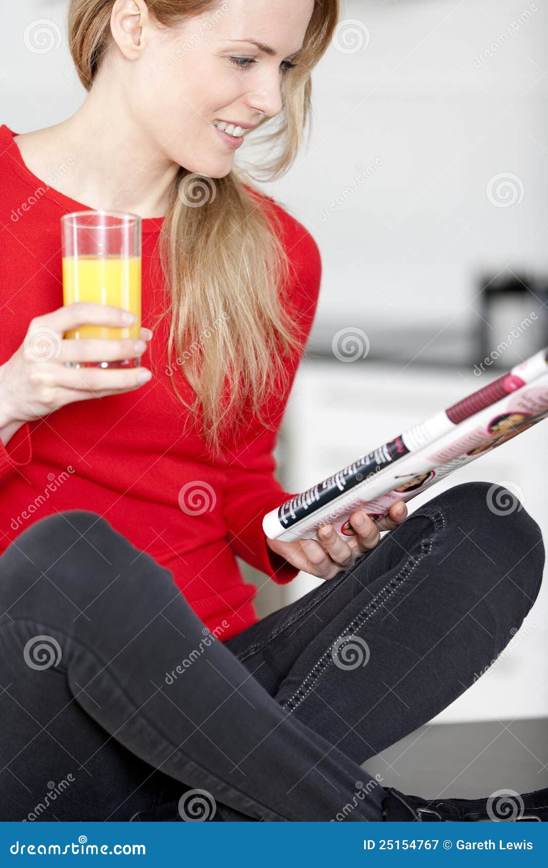 Young Woman Reading a Magazine at Home Stock Image - Image of juice ...