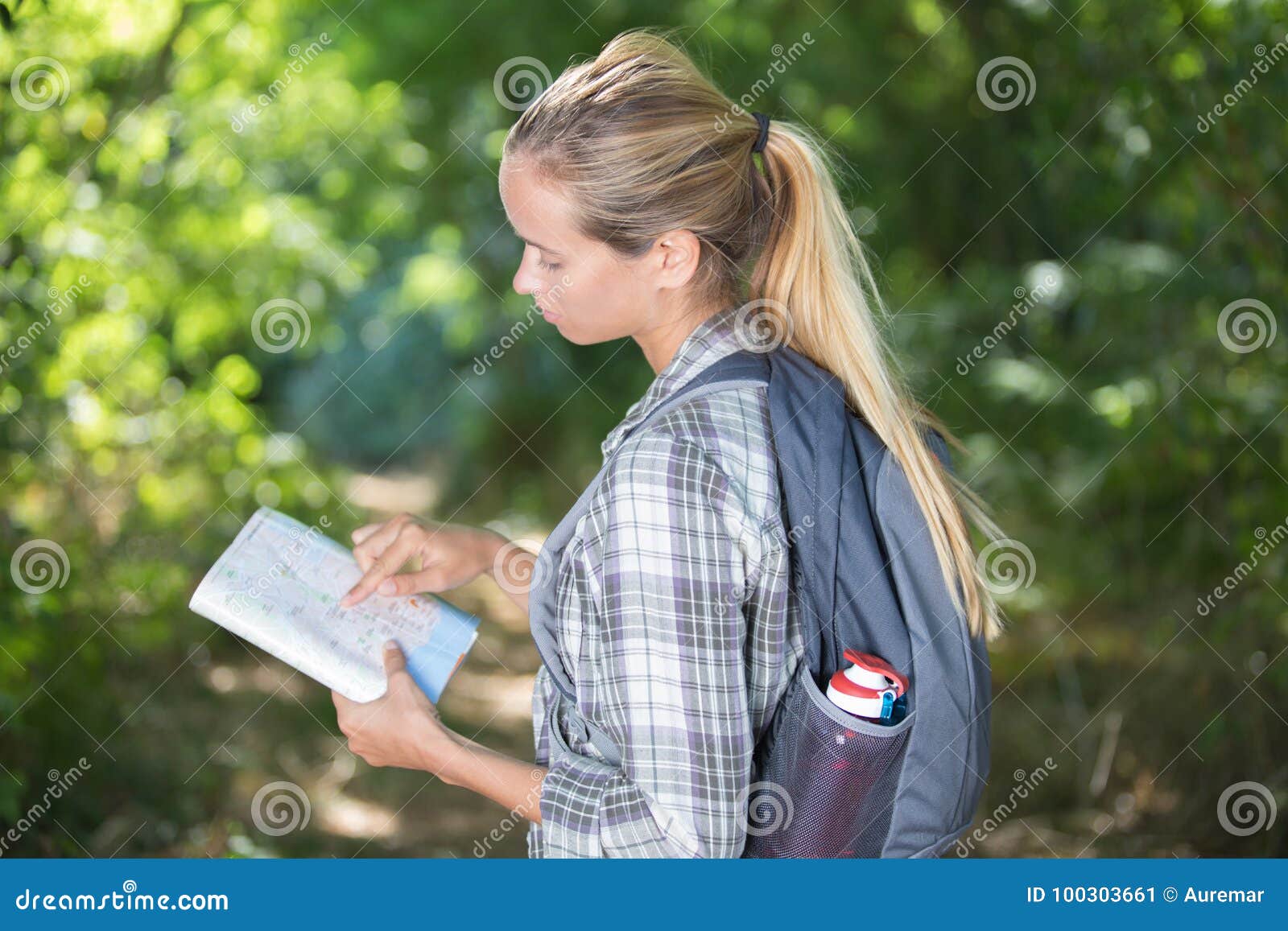 Young woman reading map stock image. Image of young - 100303661