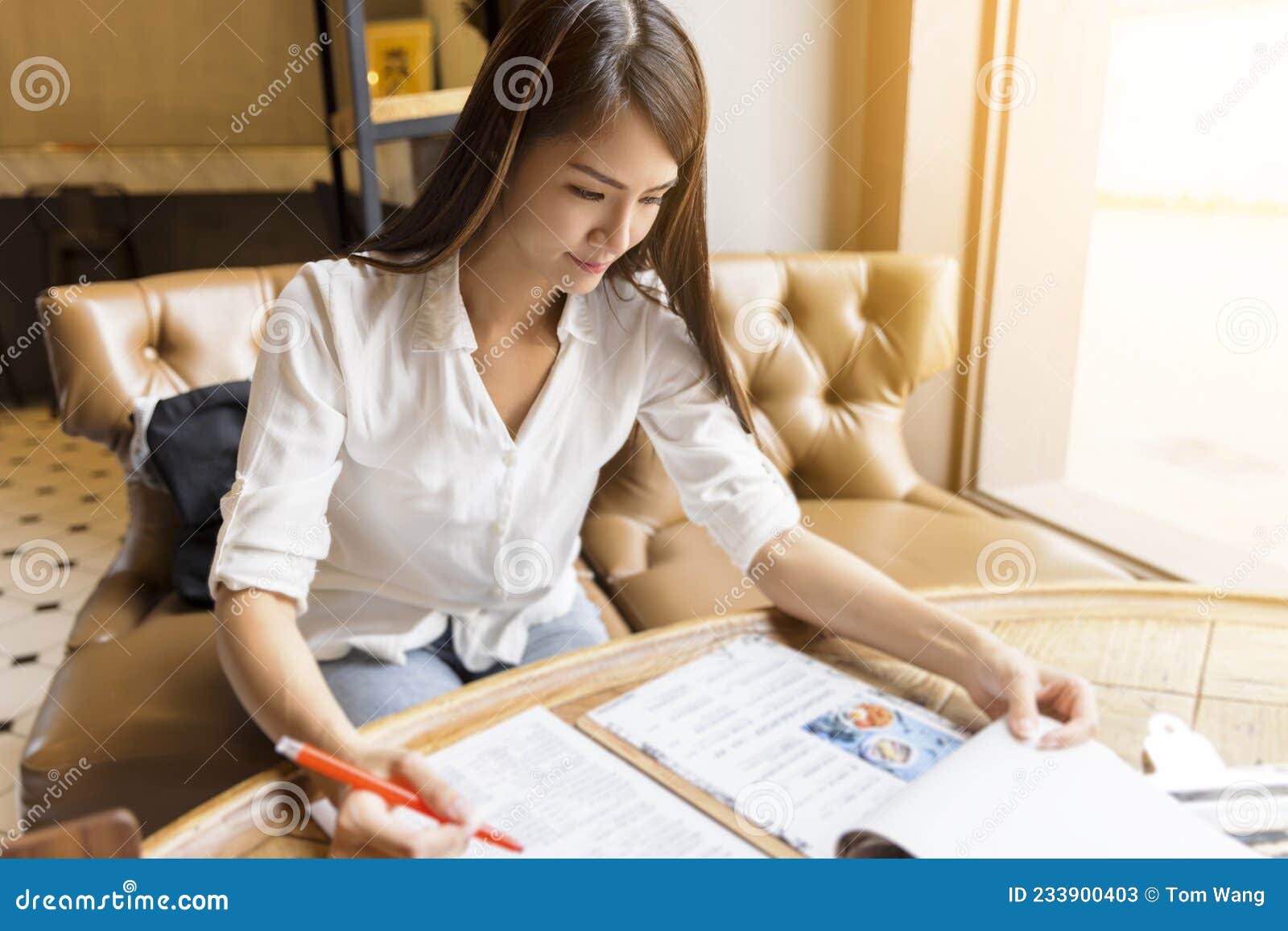 Young Woman Reading Menu in Restaurant Stock Image - Image of female ...