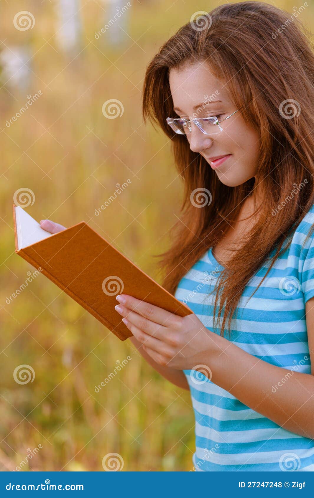 Young Woman Reading Orange Book Stock Photo - Image of beauty, european ...
