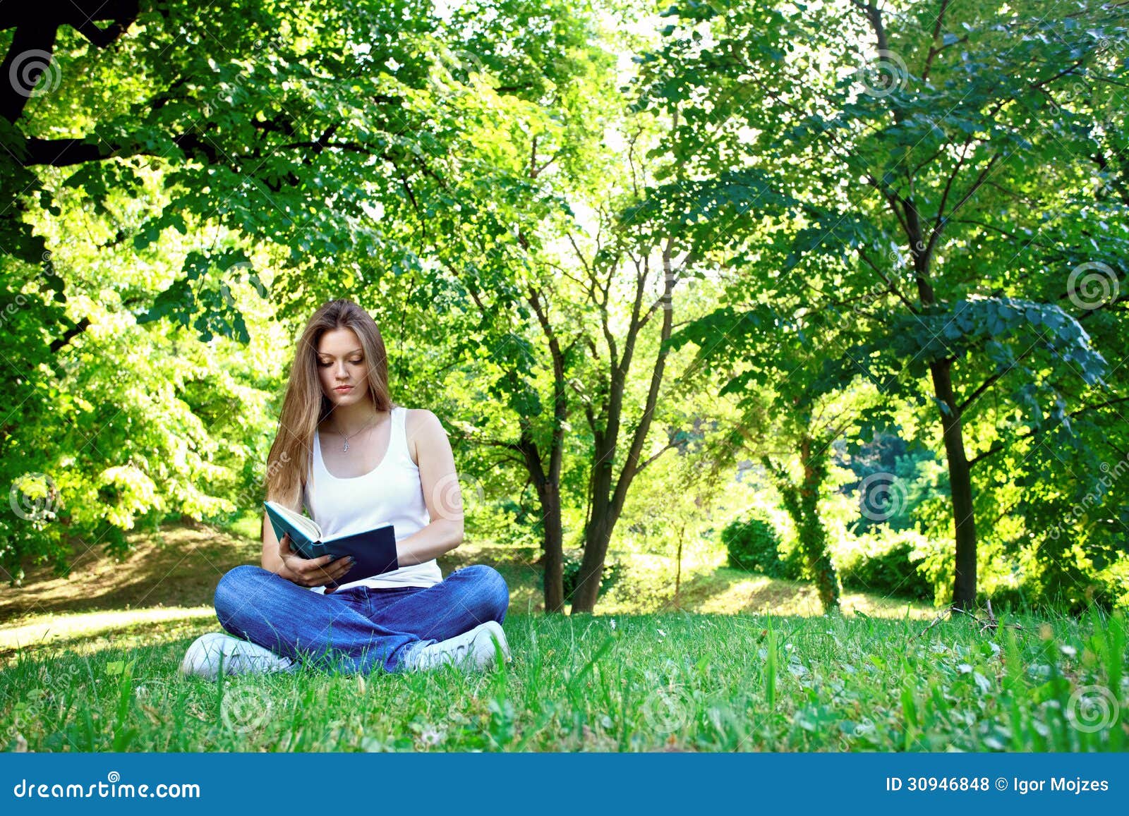 Young Woman Reading in Park Stock Photo - Image of daydreaming, outdoor ...