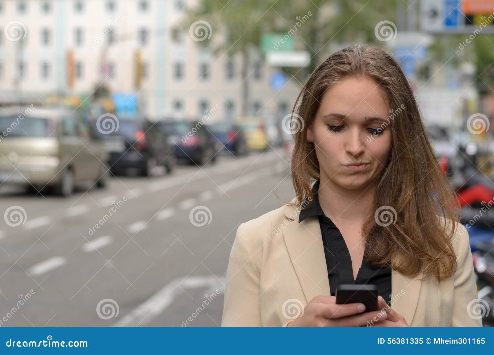 Young Woman Reading a Text Message on Her Mobile Stock Image - Image of ...