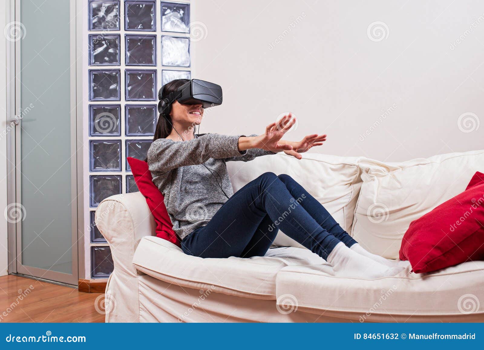 Young Woman Realxing on the Couch and Having Fun Playing a Virtual ...